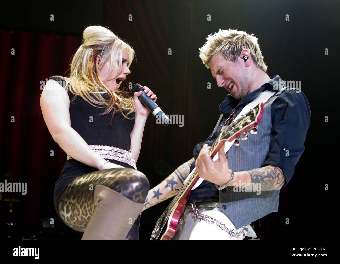 Cheyenne Kimball (L) and Mike Gossin of Gloriana perform on stage at ...