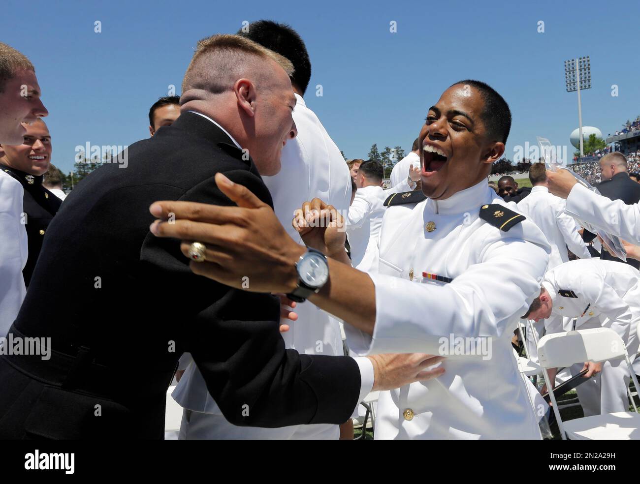 Graduating members of the U.S. Naval Academy celebrate at the end of ...