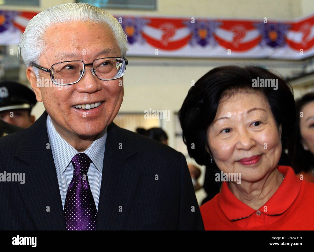 Singapore's President Tony Tan and his wife Mary Tan react during a ...