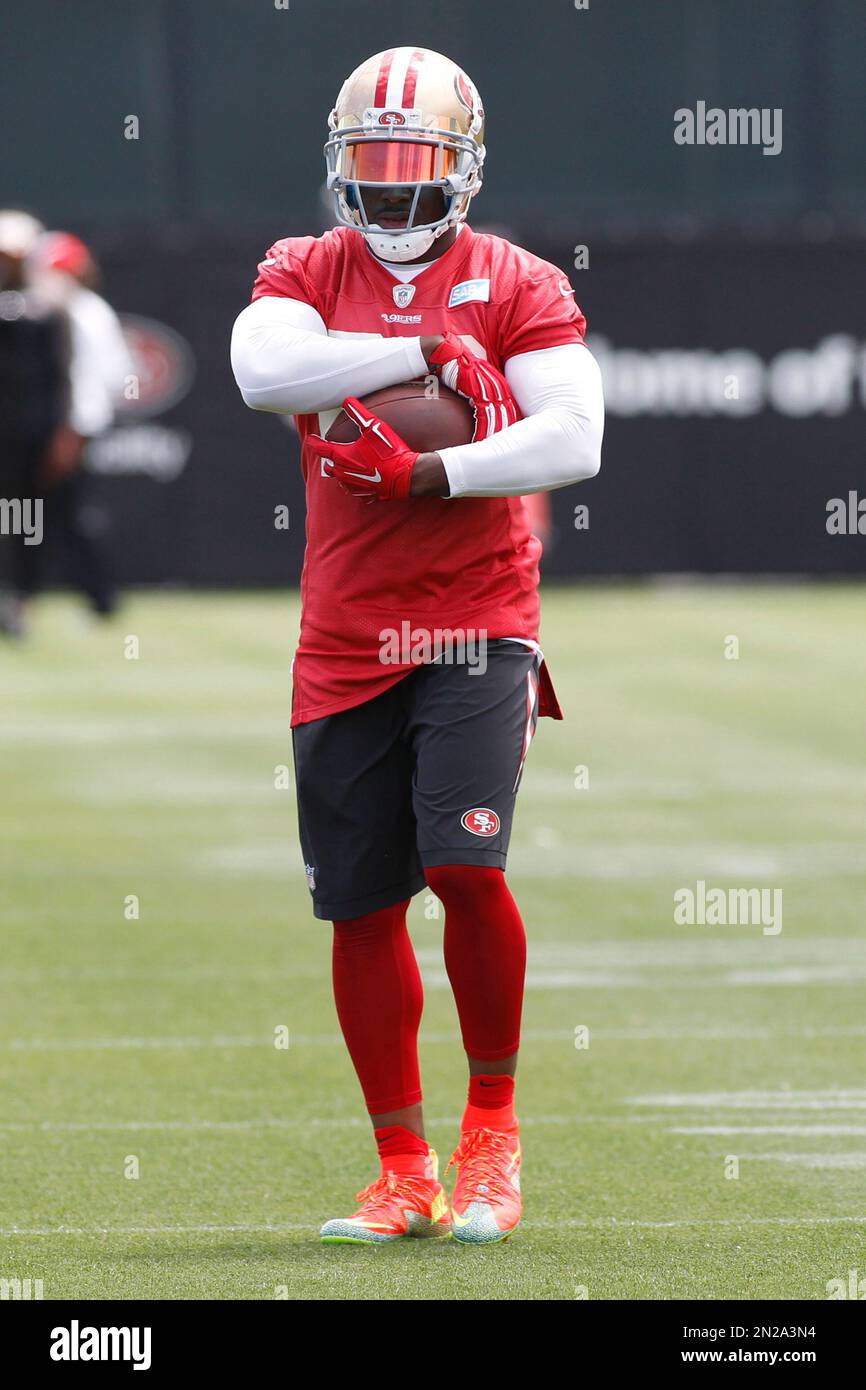 San Francisco 49ers running back Reggie Bush walks with the ball during ...
