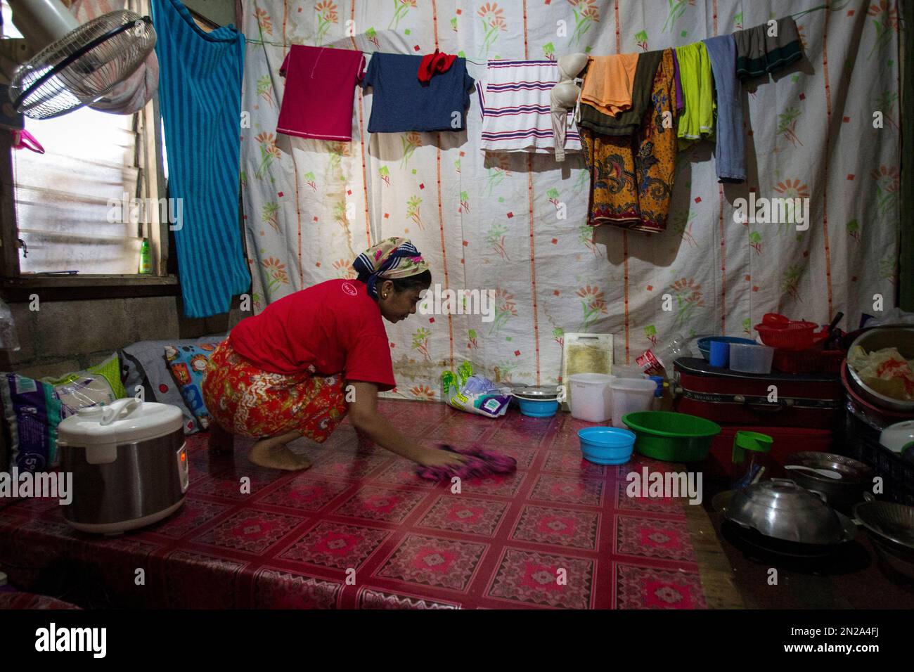 In this May 21, 2015 photo, Setarah Abdul Majid, 28, uses a rag to wipe ...