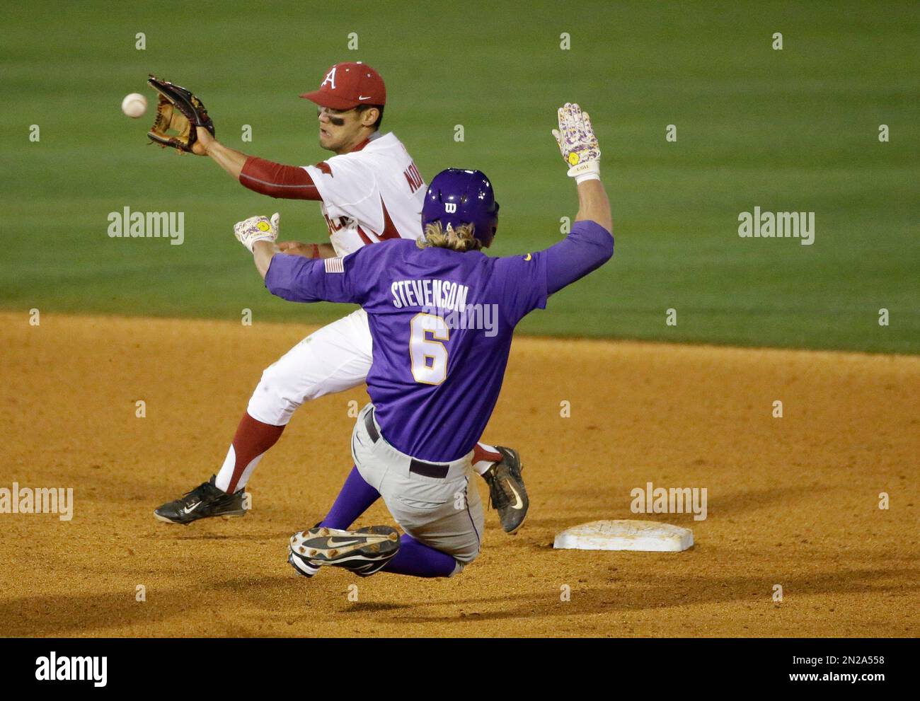 Arkansas Rick Nomura tags out LSU Andrew Stevenson during the seventh ...