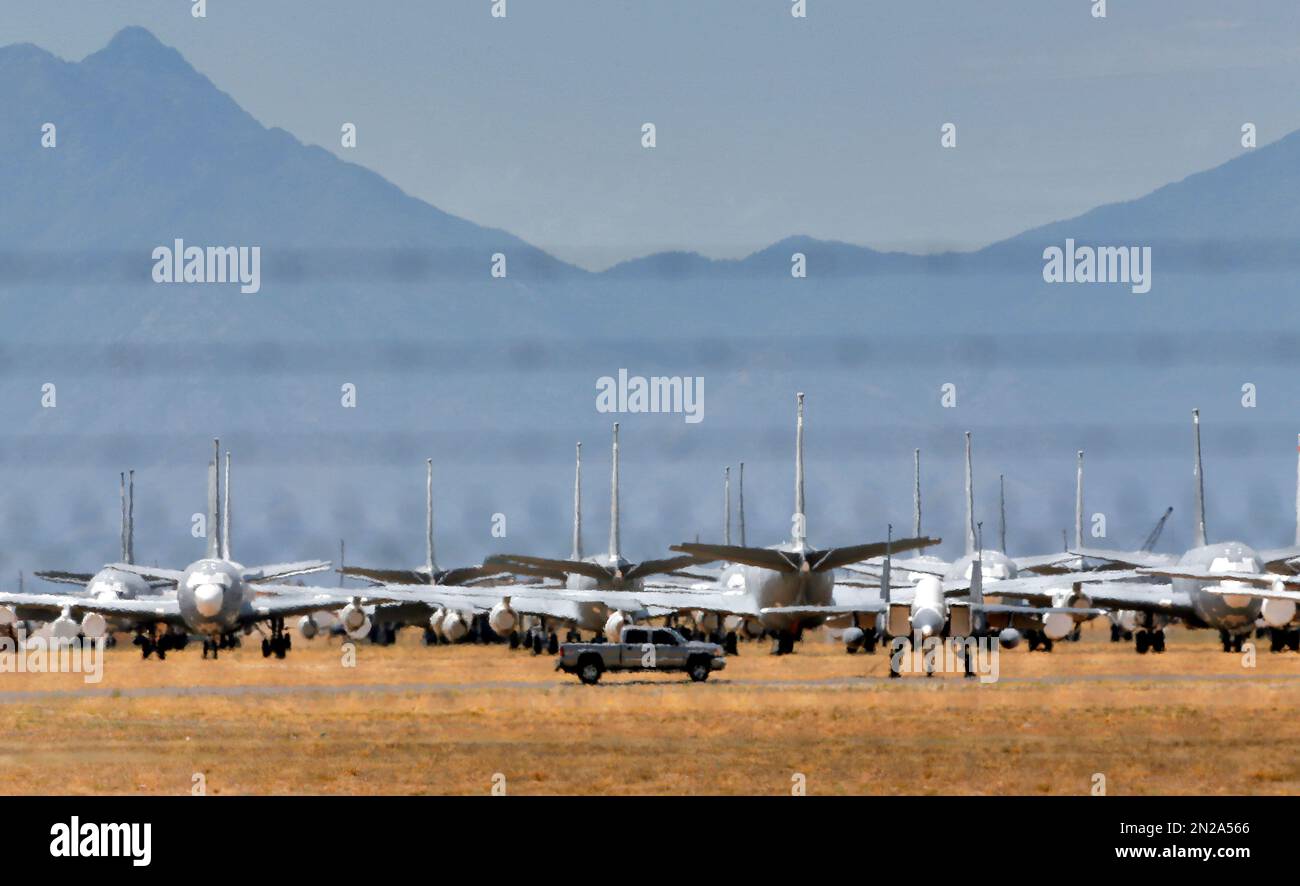 Heat ripples rise off the desert floor as seen through a barb-wired ...
