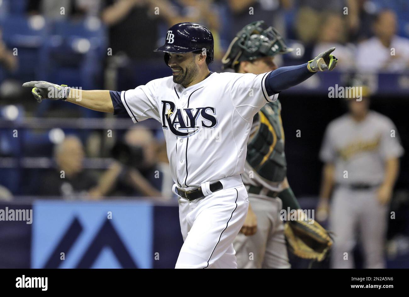 Tampa Bay Rays' David DeJesus reacts as he crosses home plate after a ...