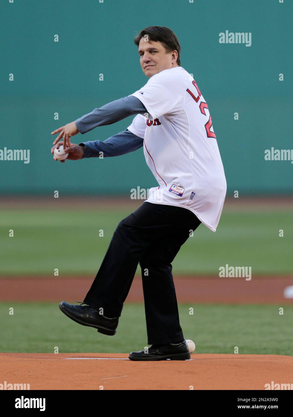 Boston Pops conductor Keith Lockhart delivers the ceremonial first ...