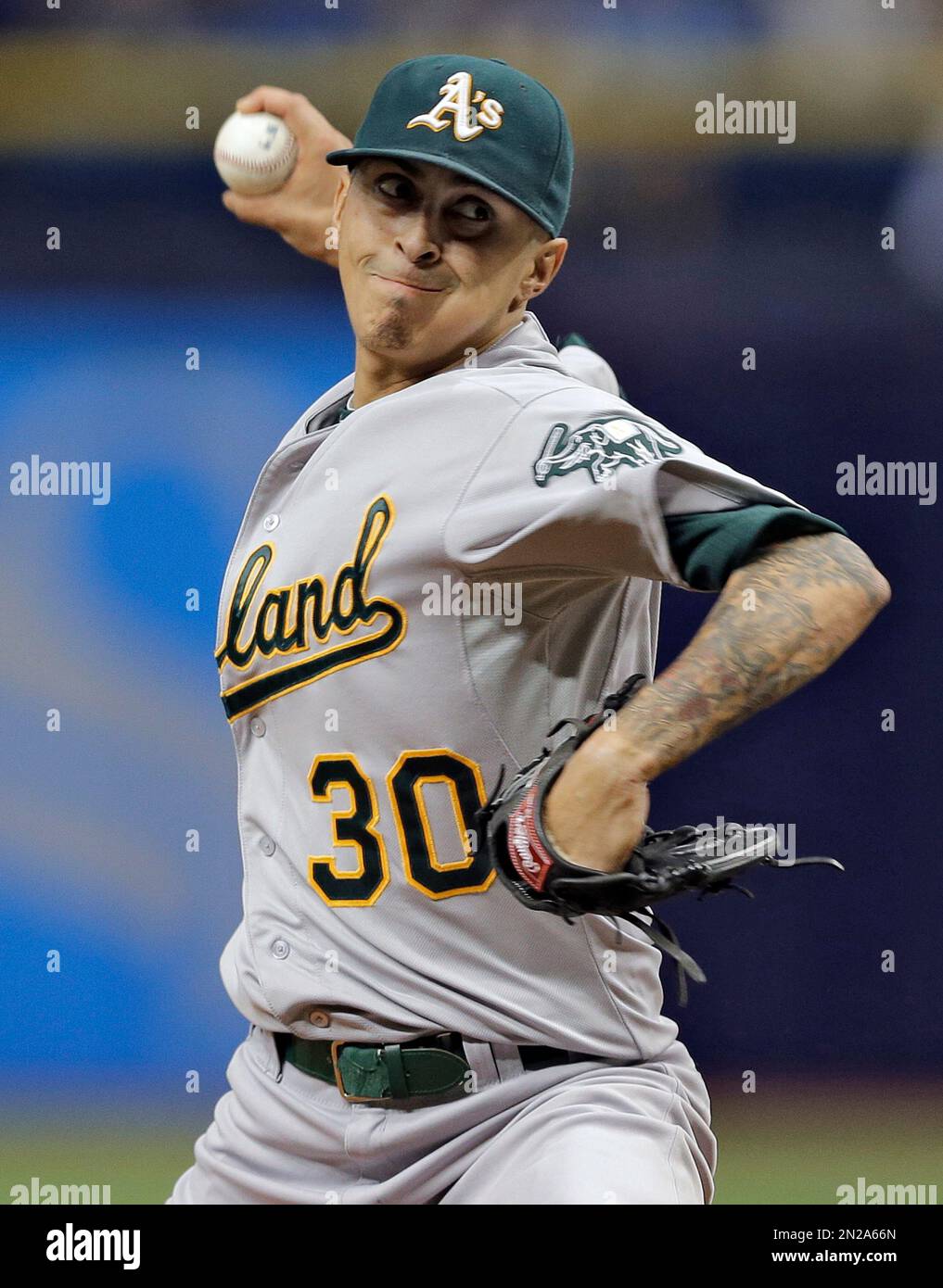 Oakland Athletics starting pitcher Jesse Chavez winds up on a throw to ...