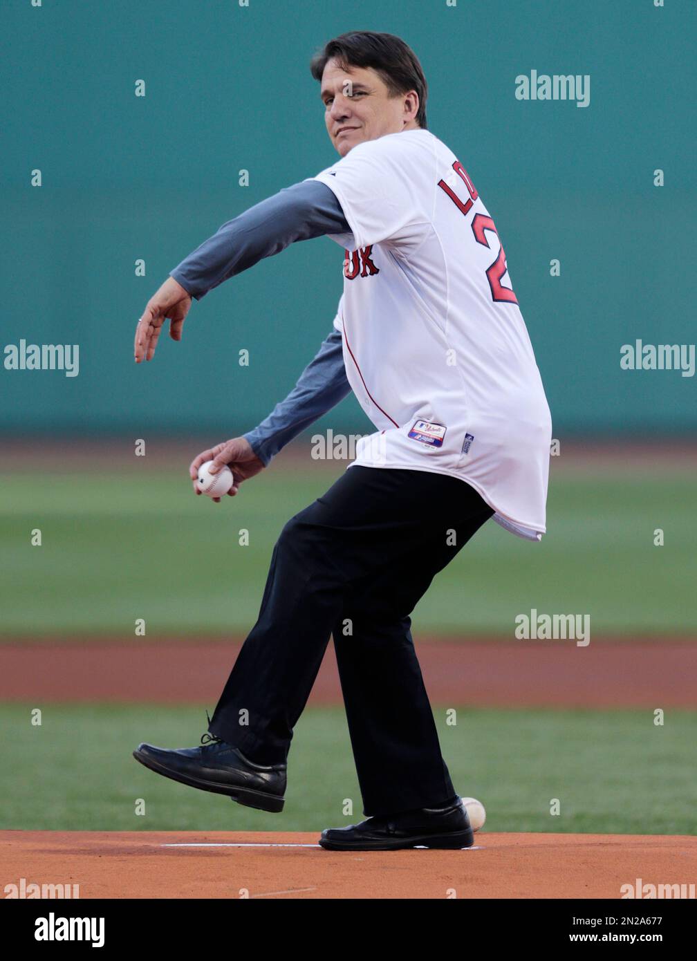 Boston Pops conductor Keith Lockhart delivers the ceremonial first ...