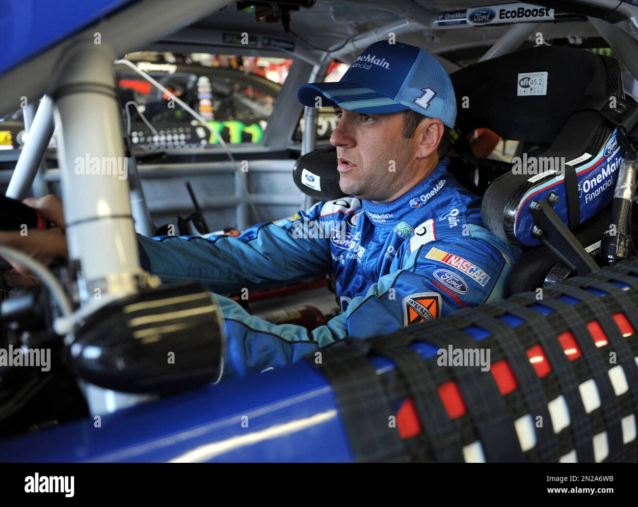 Elliott Sadler waits in his car before practice for Saturday's NASCAR ...