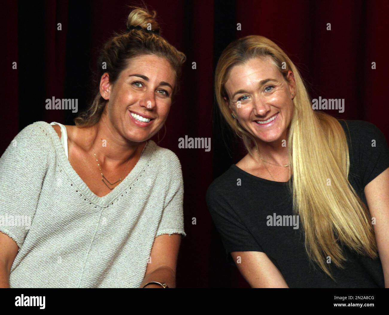 In this April 15, 2015, photo, beach volleyball players April Ross ...