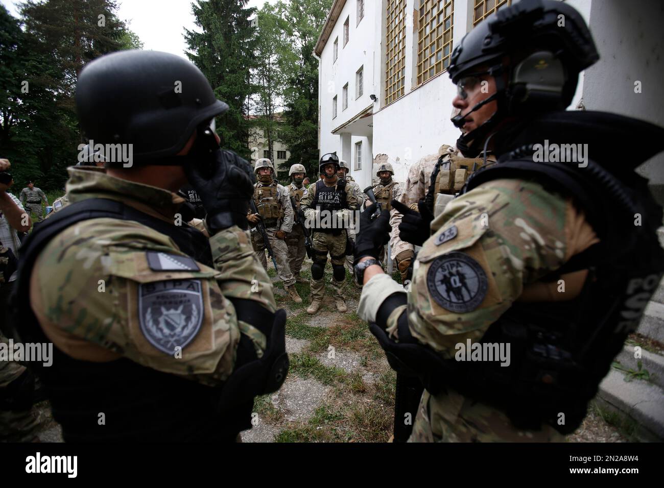 US marines accompanied with Bosnian police forces take part in an ...