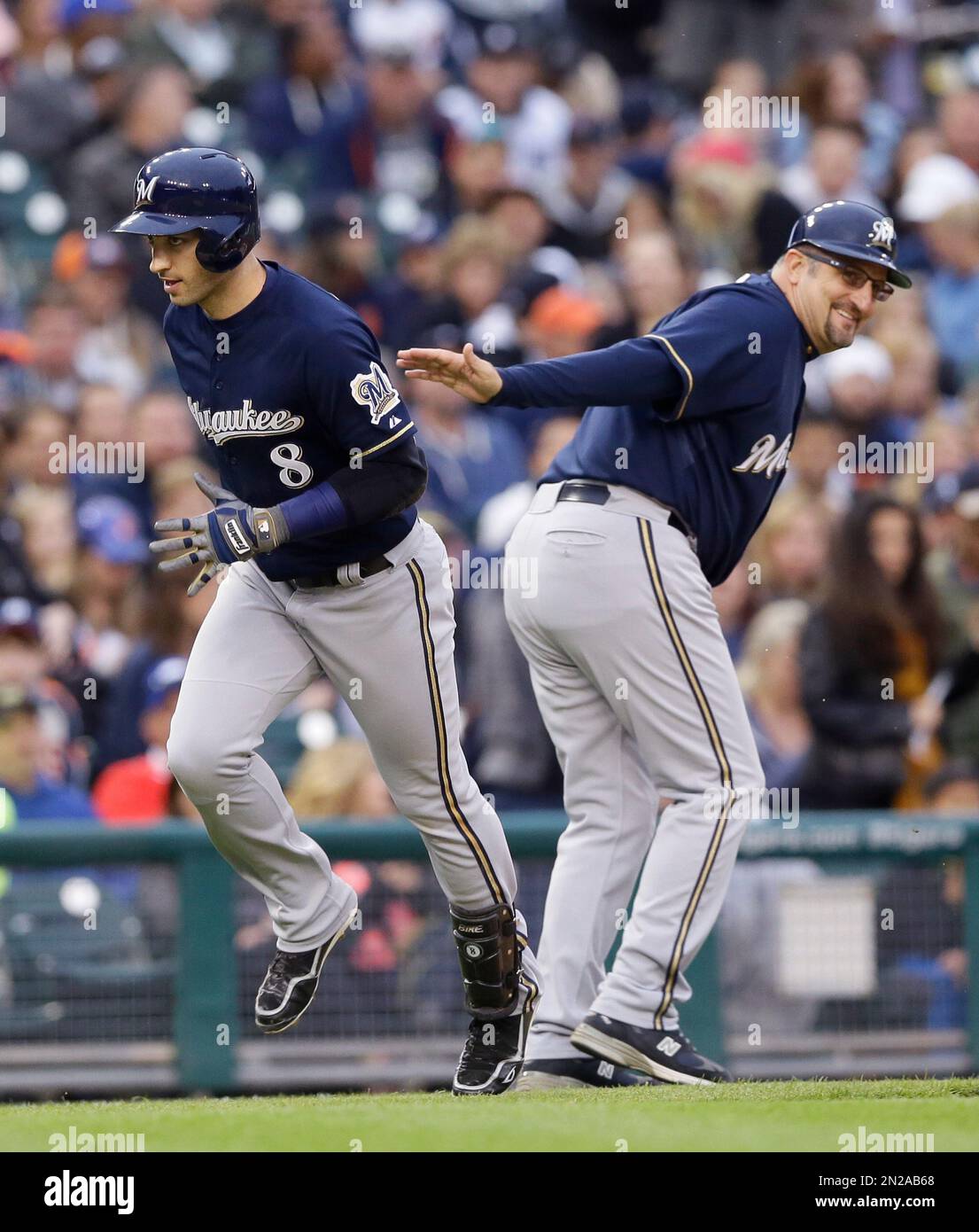 Milwaukee Brewers third base coach Ed Sedar looks back as Ryan Braun ...