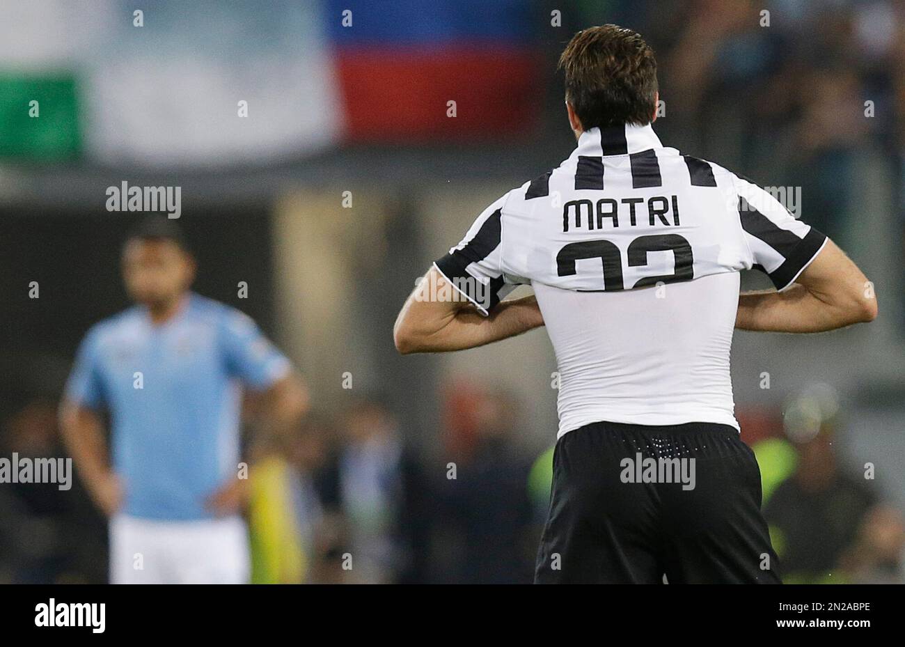 Juventus' Alessandro Matri, right, wears his jersey after scoring ...