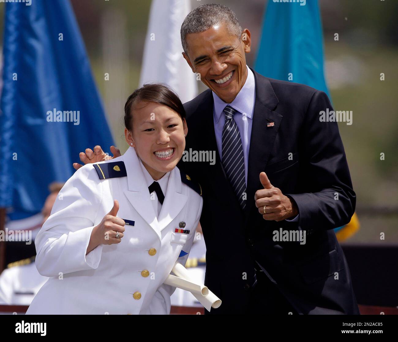 President Barack Obama flashes a thumbs-up with newly commissioned ...