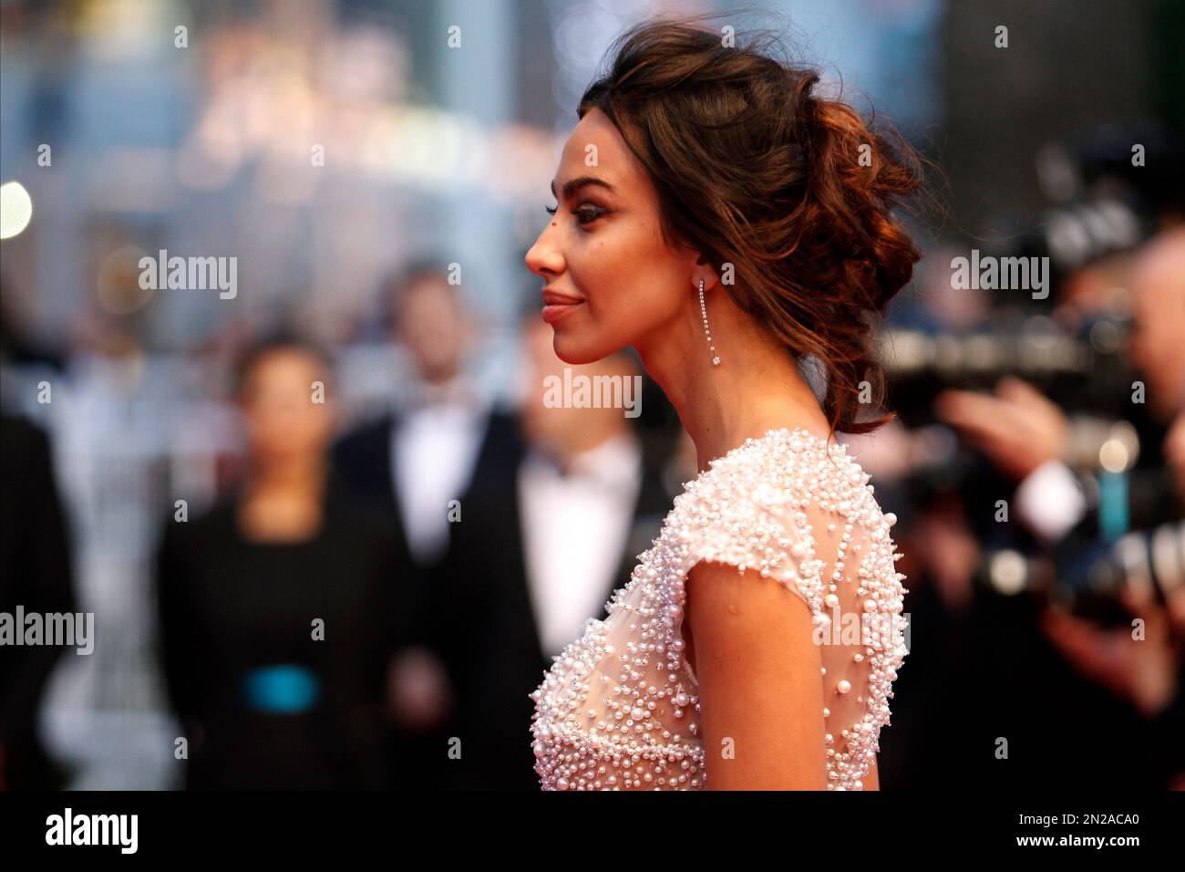 Actress Madalina Ghenea poses for photographers as the cast leave ...