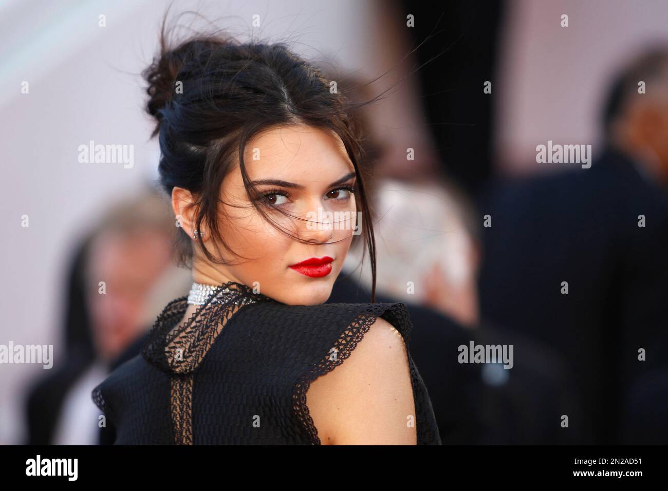 Model Kendall Jenner poses for photographers as she arrives for the ...