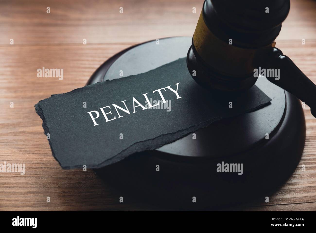 A gavel and a piece of paper written with Penalty Stock Photo - Alamy