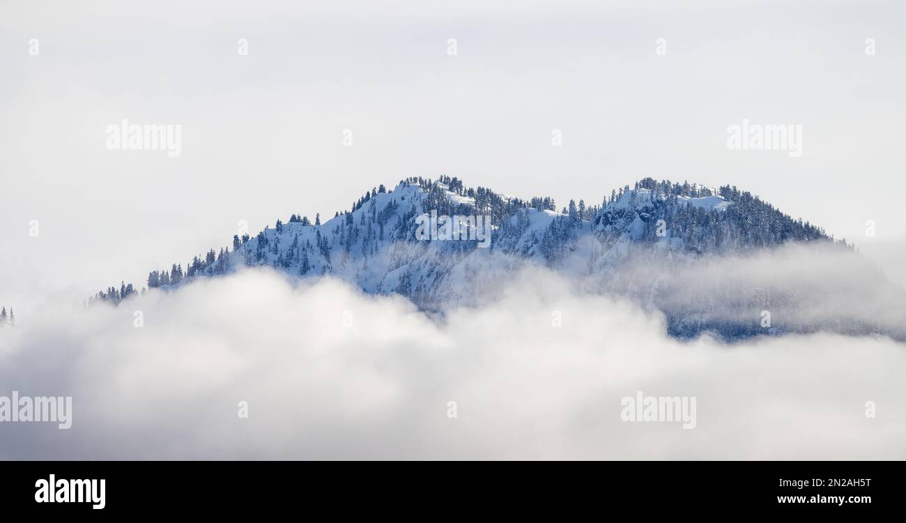 Snow and Cloud covered Canadian Nature Landscape Background Stock Photo ...