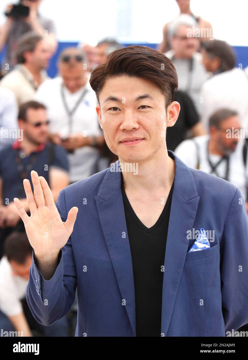 Director Hong Won-chan poses for photographers during a photo call for ...
