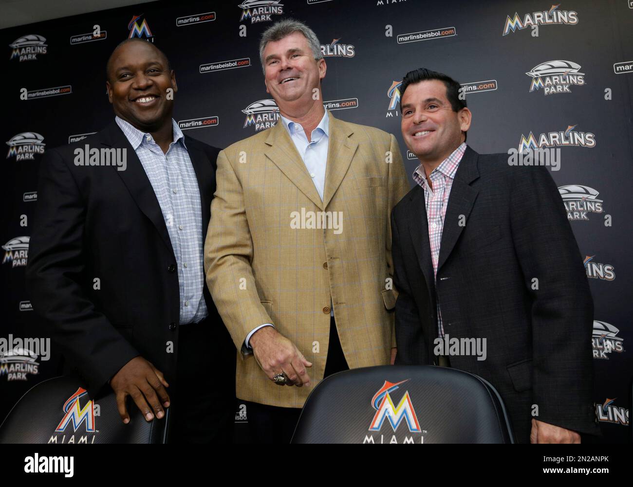 New Miami Marlins manager Dan Jennings, center, poses for a photograph ...
