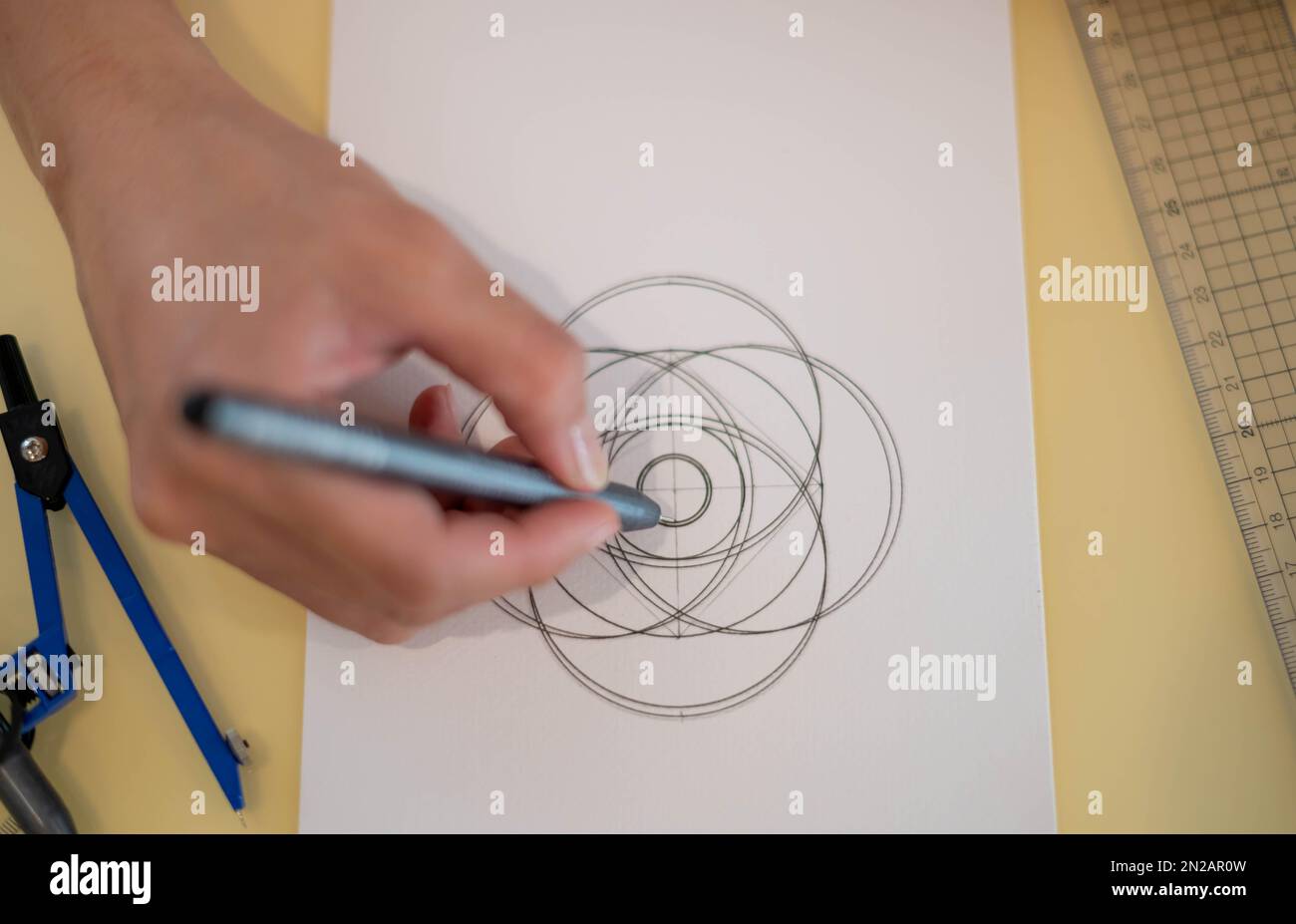 Female hand using a black magic pen preparing to draw and sketch the ...
