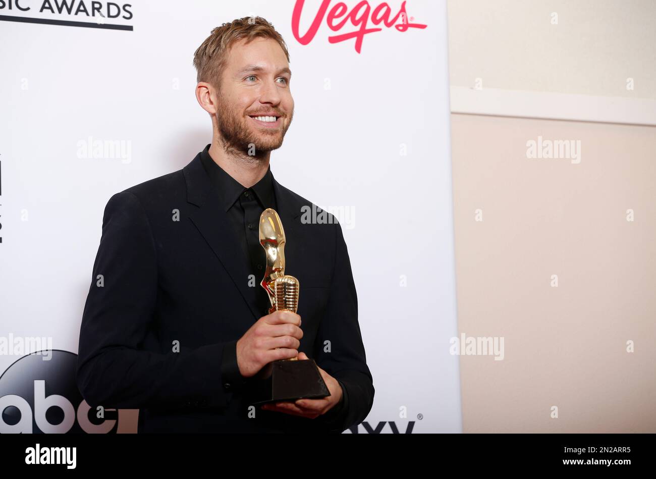Calvin Harris poses in the press room with the award for top dance ...