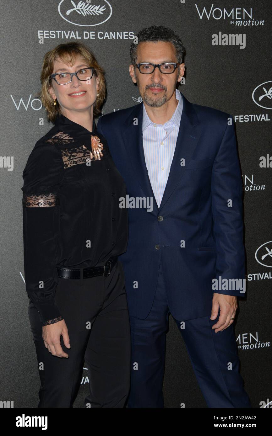 Katherine Borowitz and John Turturro pose for photographers upon ...