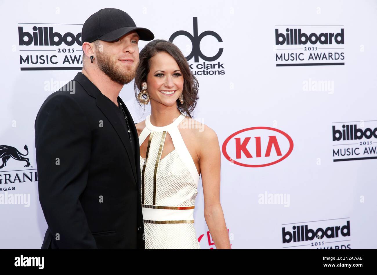 Brantley Gilbert, left, and Amber Cochran arrive at the Billboard Music ...