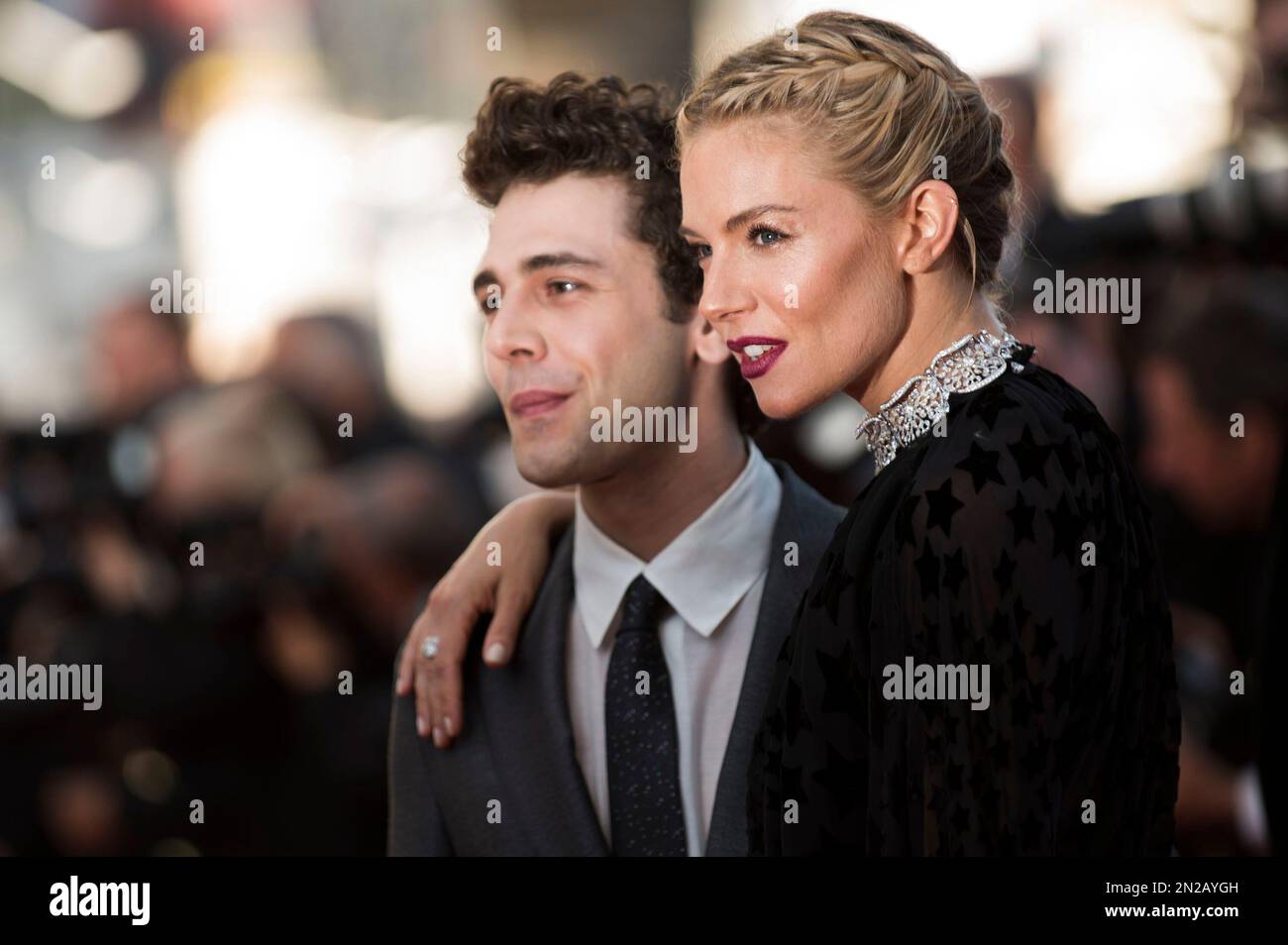 Xavier Dolan and Sienna Miller pose for photographers upon arrival for ...