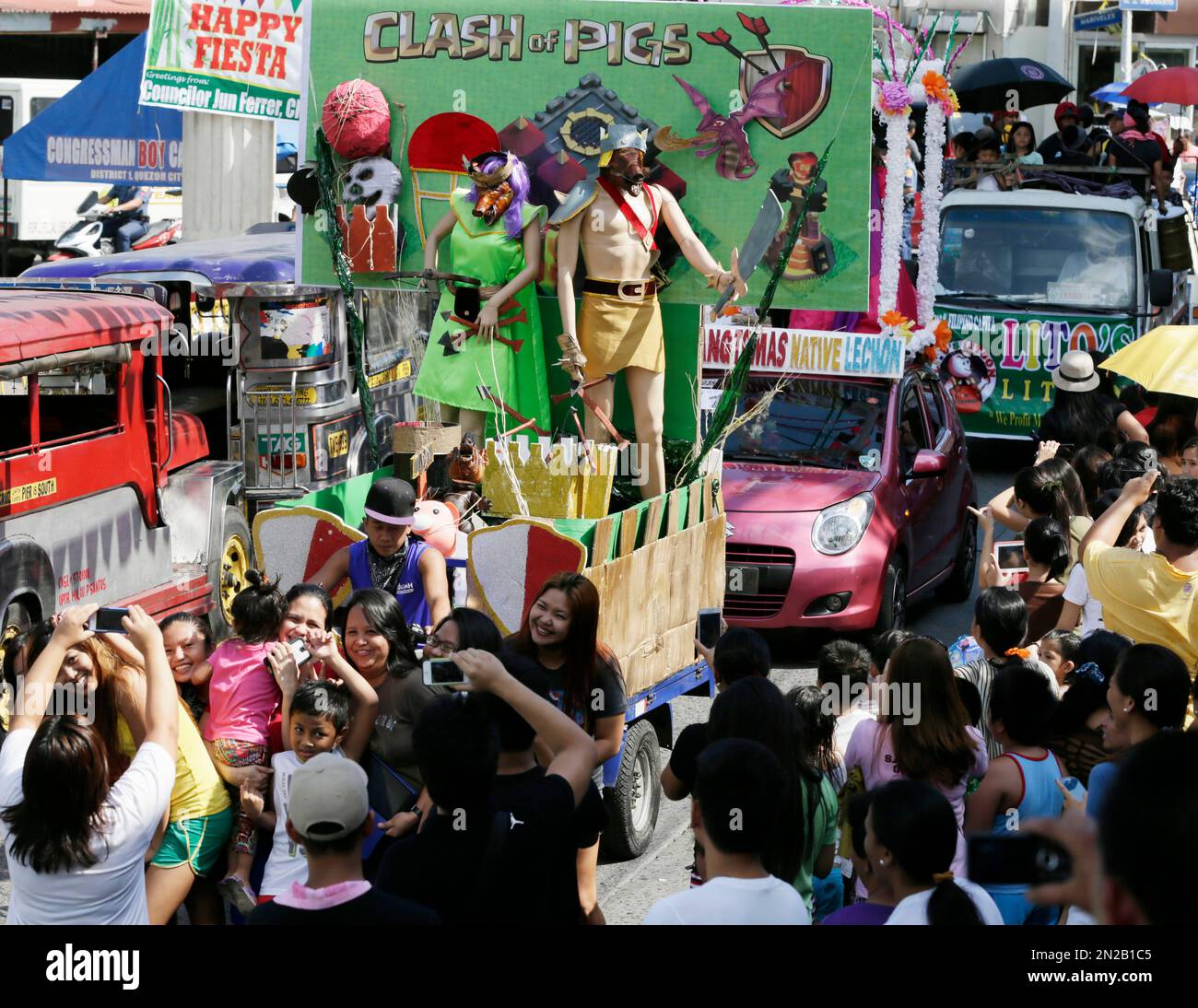 A float with roast pigs dressed as characters of a popular movie is ...