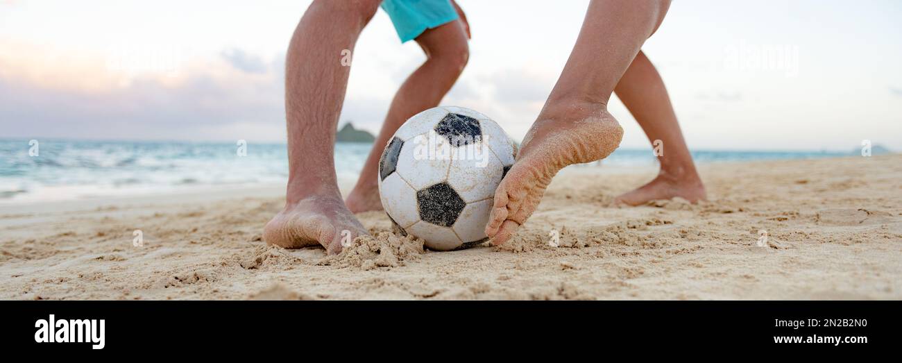 Soccer sport fun playing friends kicking ball with feet on beach ...