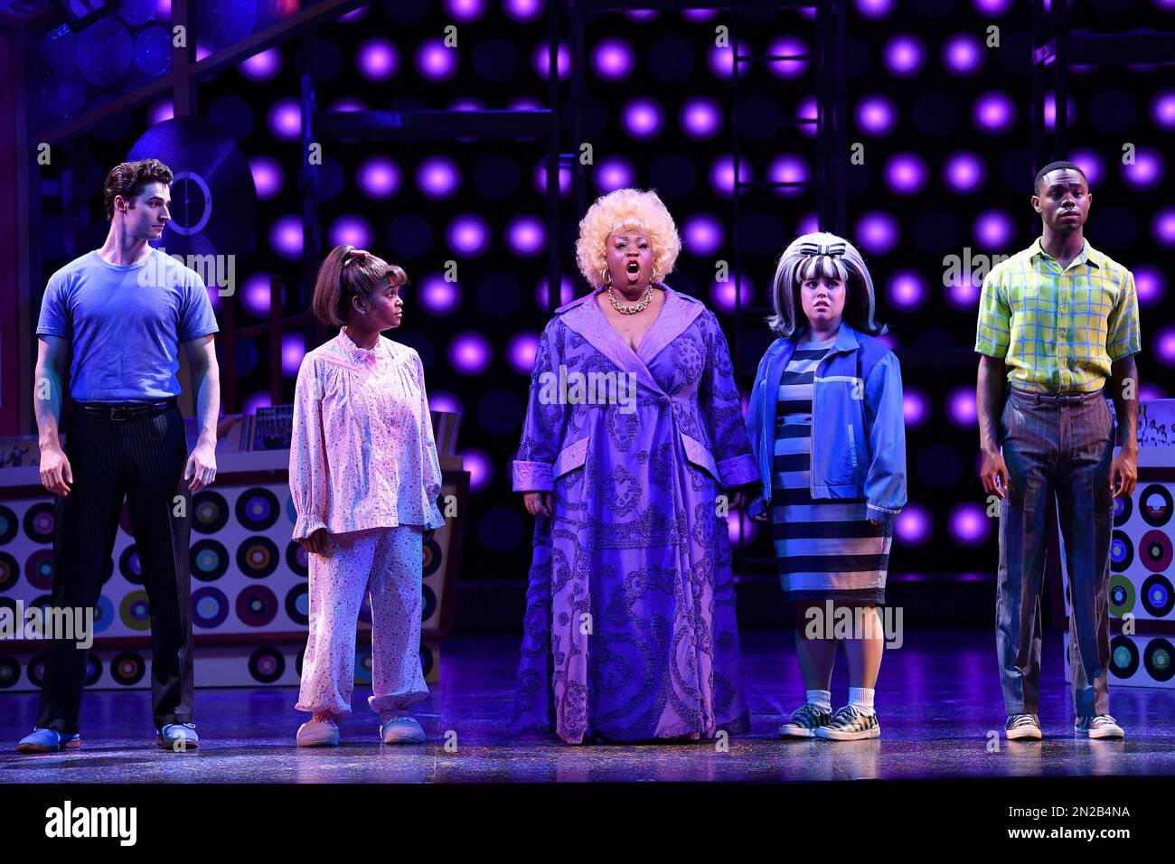 Asabi Goodman, in the character of Motormouth Maybelle (centre left ...