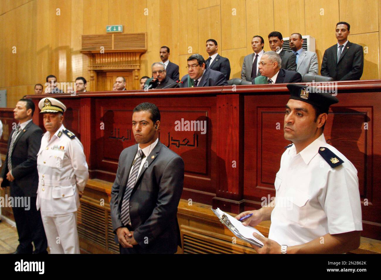 Egyptian Judge Shaaban el-Shami, center, sentences ousted Egyptian President Mohammed Morsi to ...