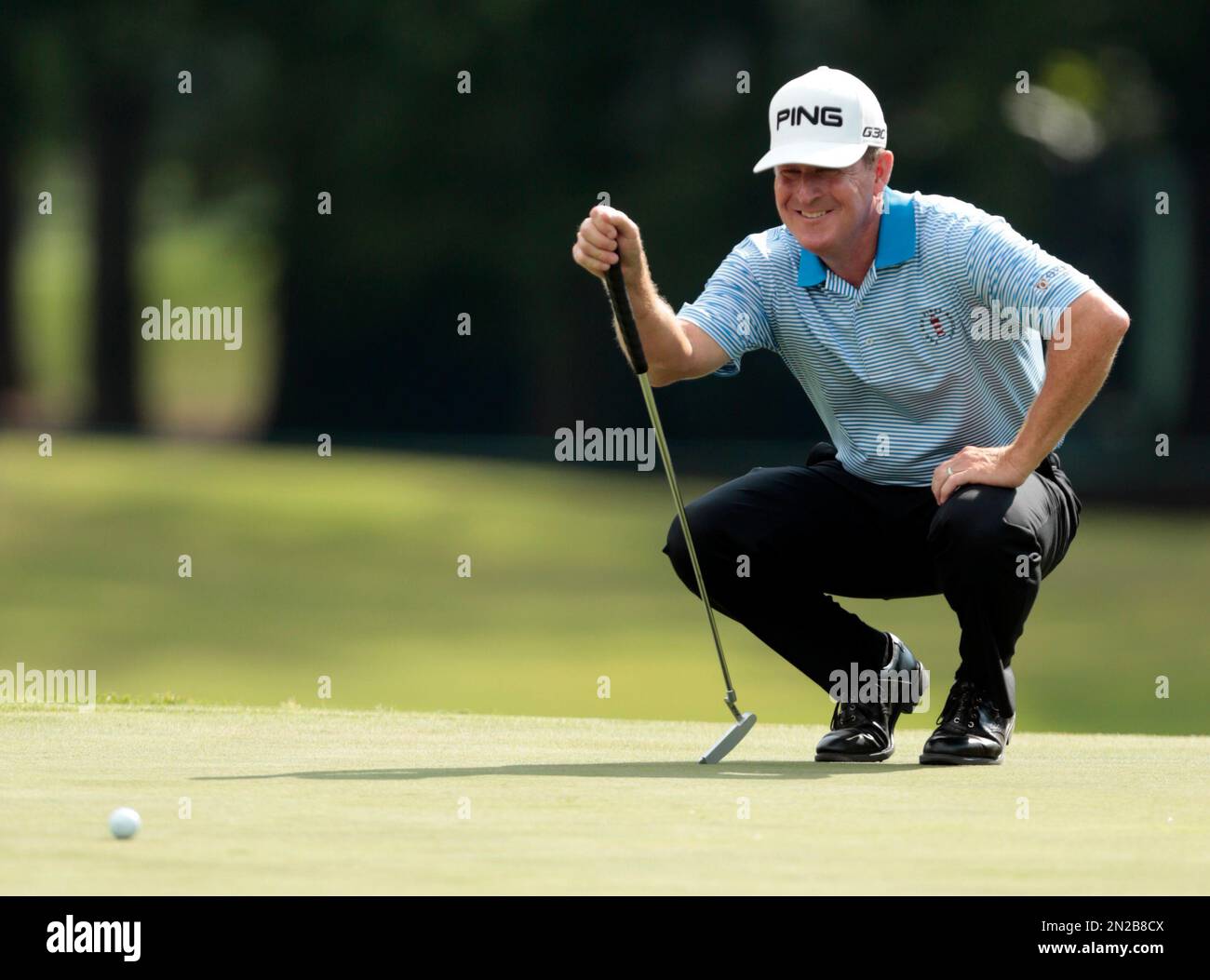 Jeff Maggert lines up his putt on the 18th green during the Regions ...