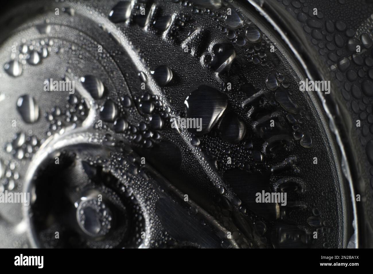 close up of canned drinks dewy from cold with focus on the inscription ...