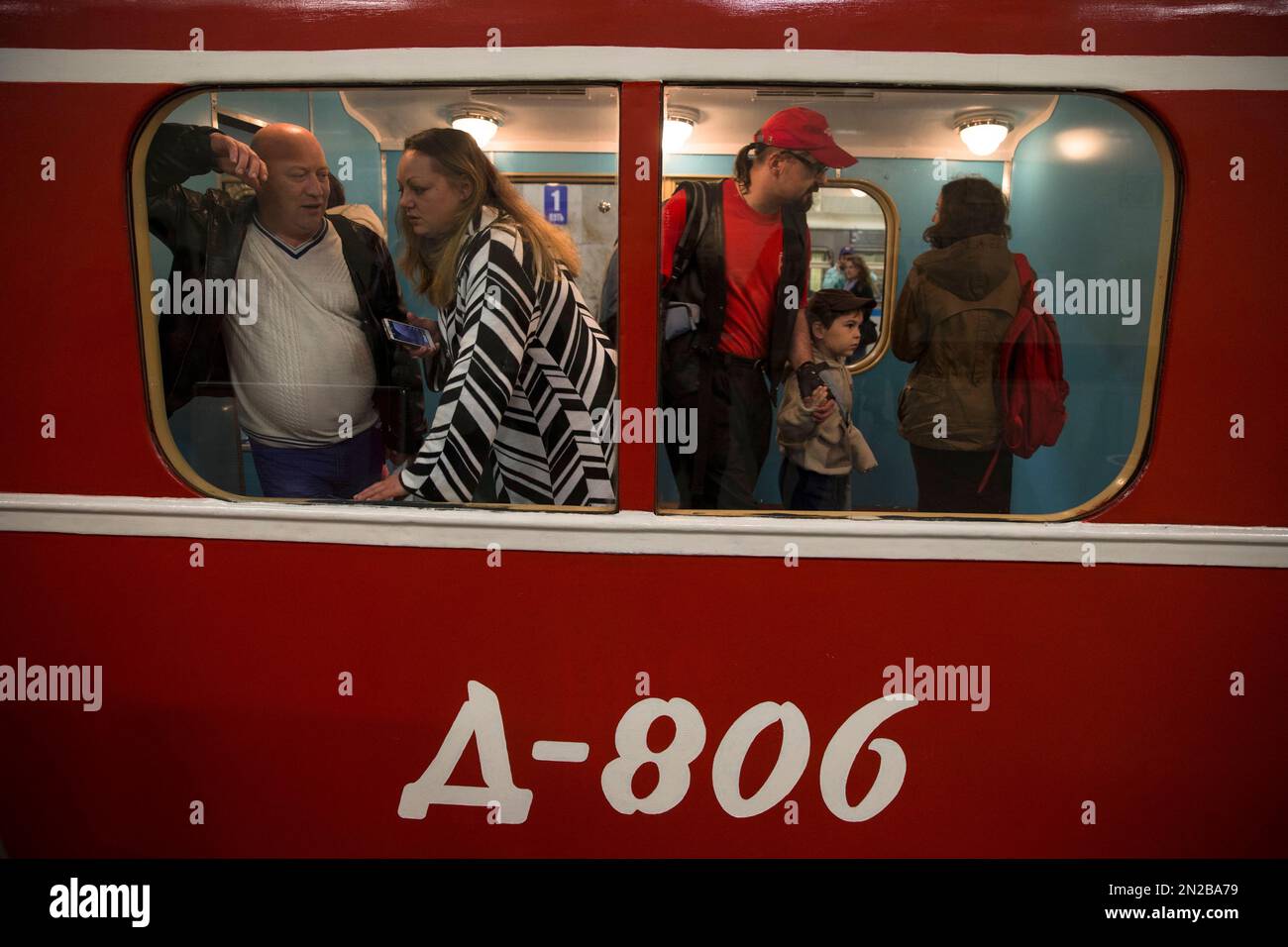 People examine the interior of a Soviet-era vintage subway car parked ...