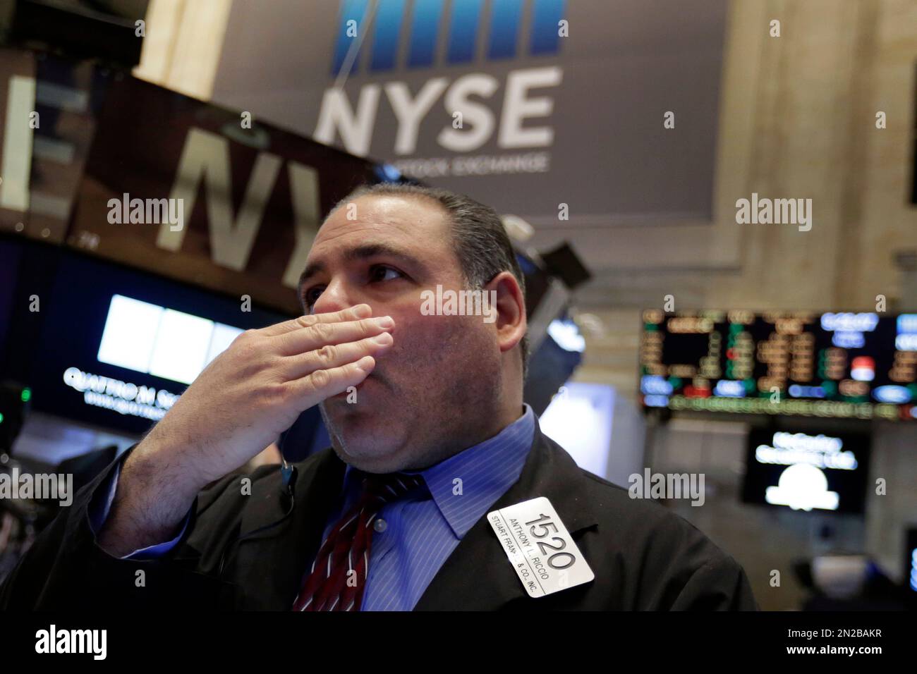 Trader Anthony Riccio works on the floor of the New York Stock Exchange ...