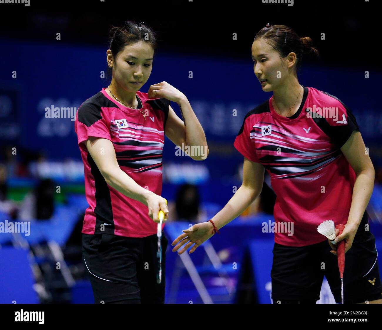 South Korea's Jung Kyung-eun, left, chats with her partner Chang Ye-na ...