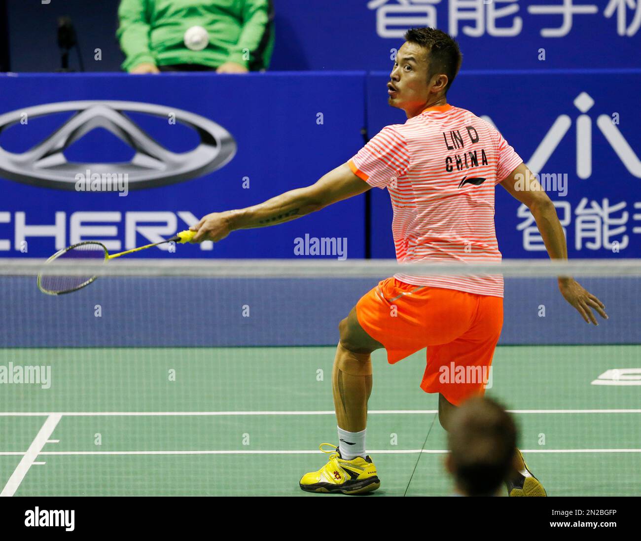 China's Lin Dan makes a backhand return during his match against ...
