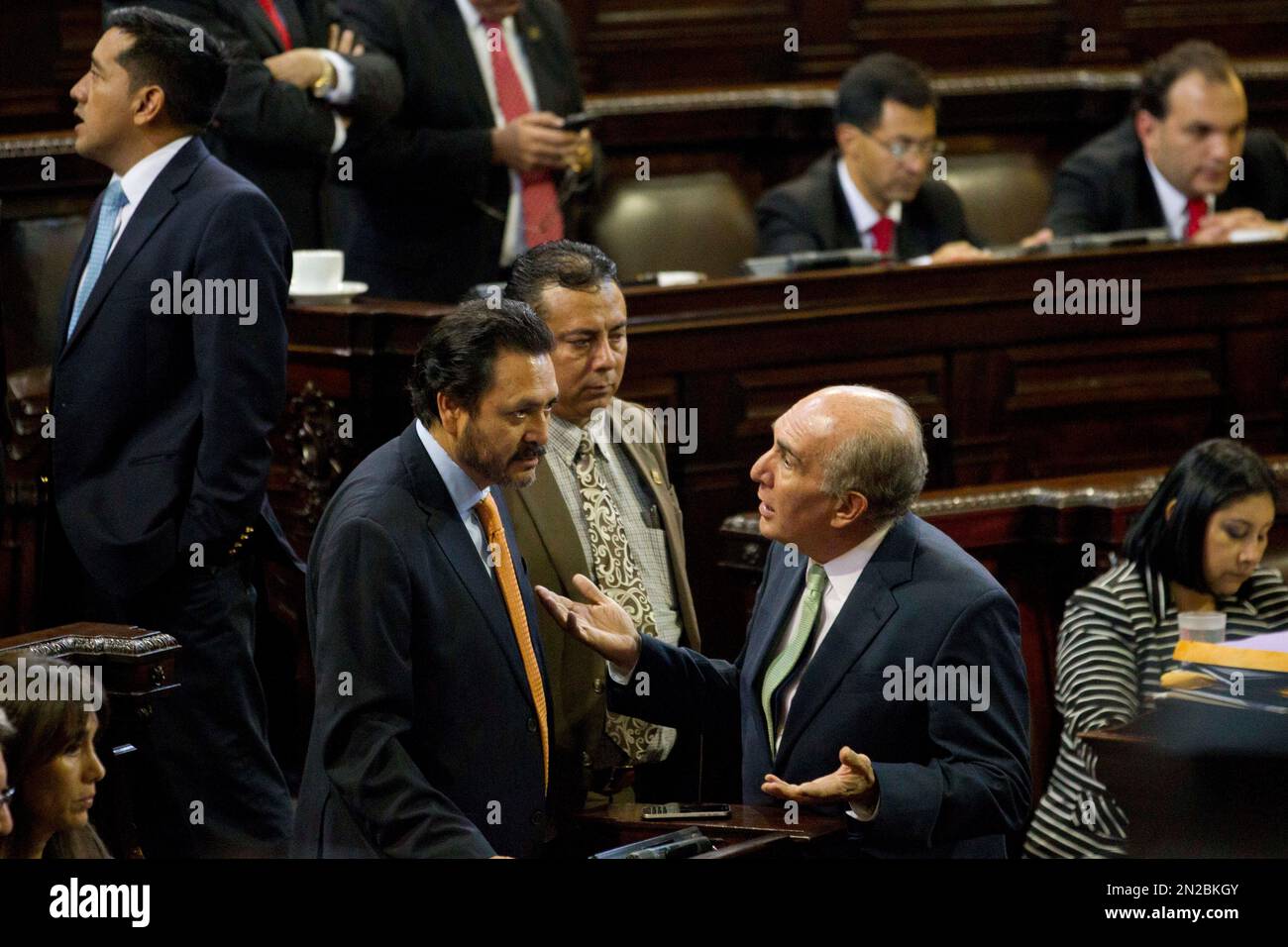 National Unity of Hope party lawmaker Mario Taracena, right, talks with ...