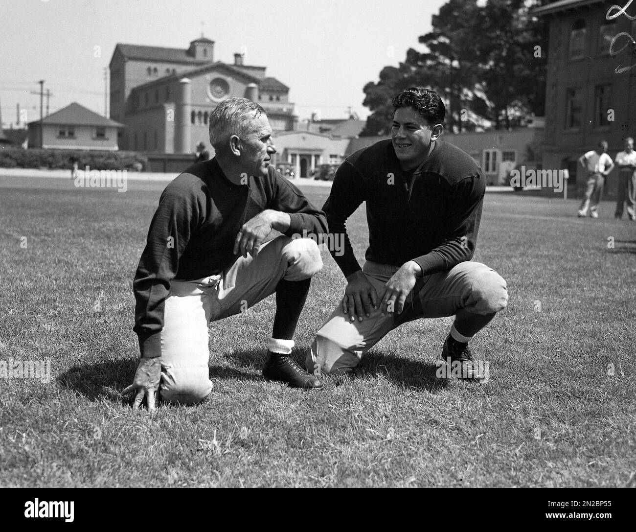 Coach Howard Jones, left, and Gil Kuhn, captain and star center, are ...