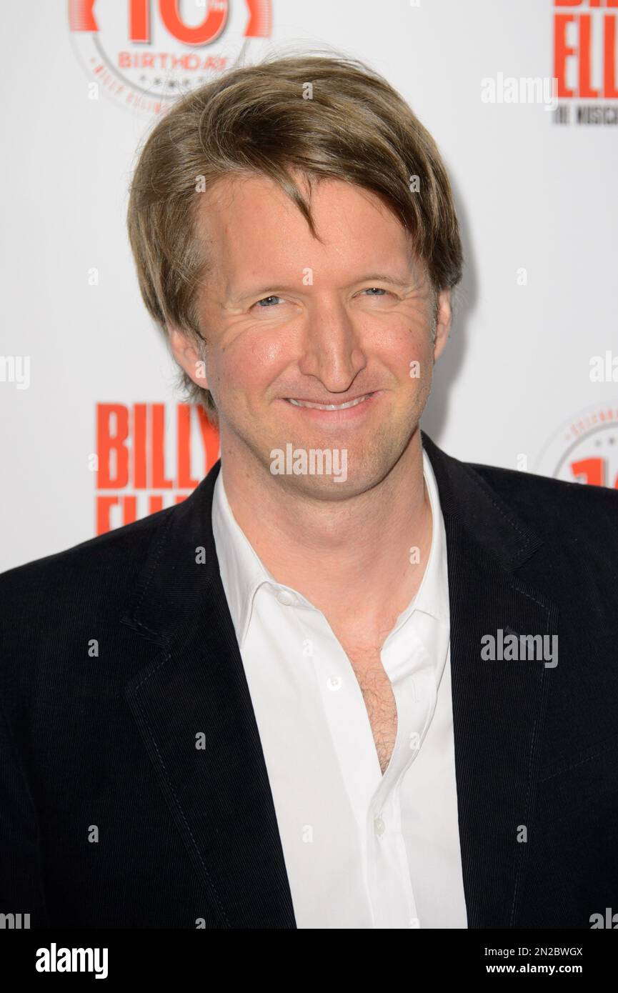 Tom Hooper poses for photographers upon arrival for Billy Elliot The ...