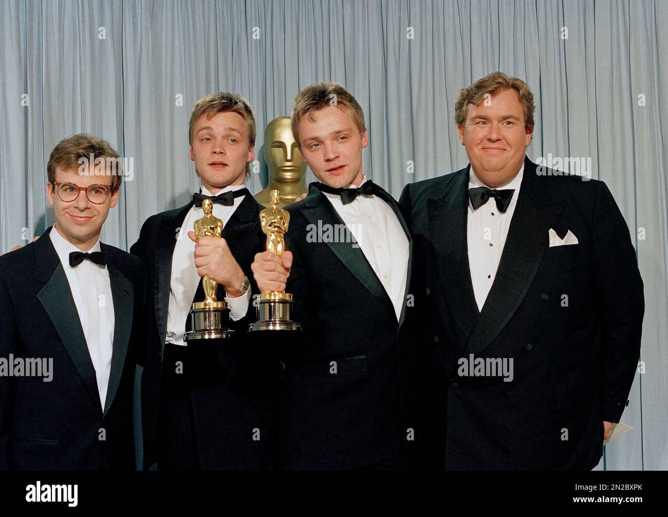Rick Moranis, left, and John Candy, right, flank Christoph (second from ...