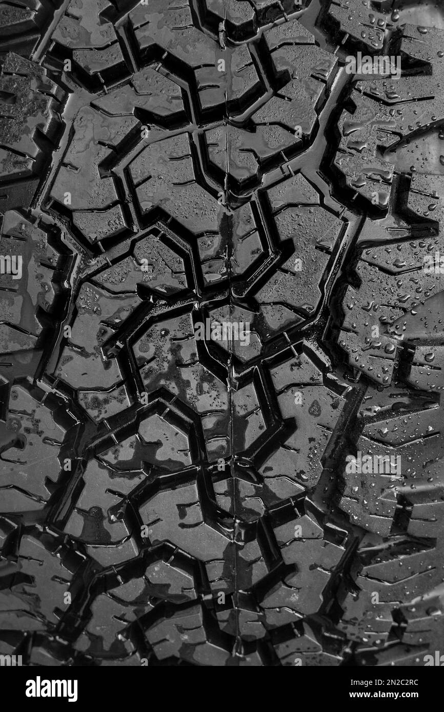 Close-up of black off-road tire tread pattern background vertical Stock ...
