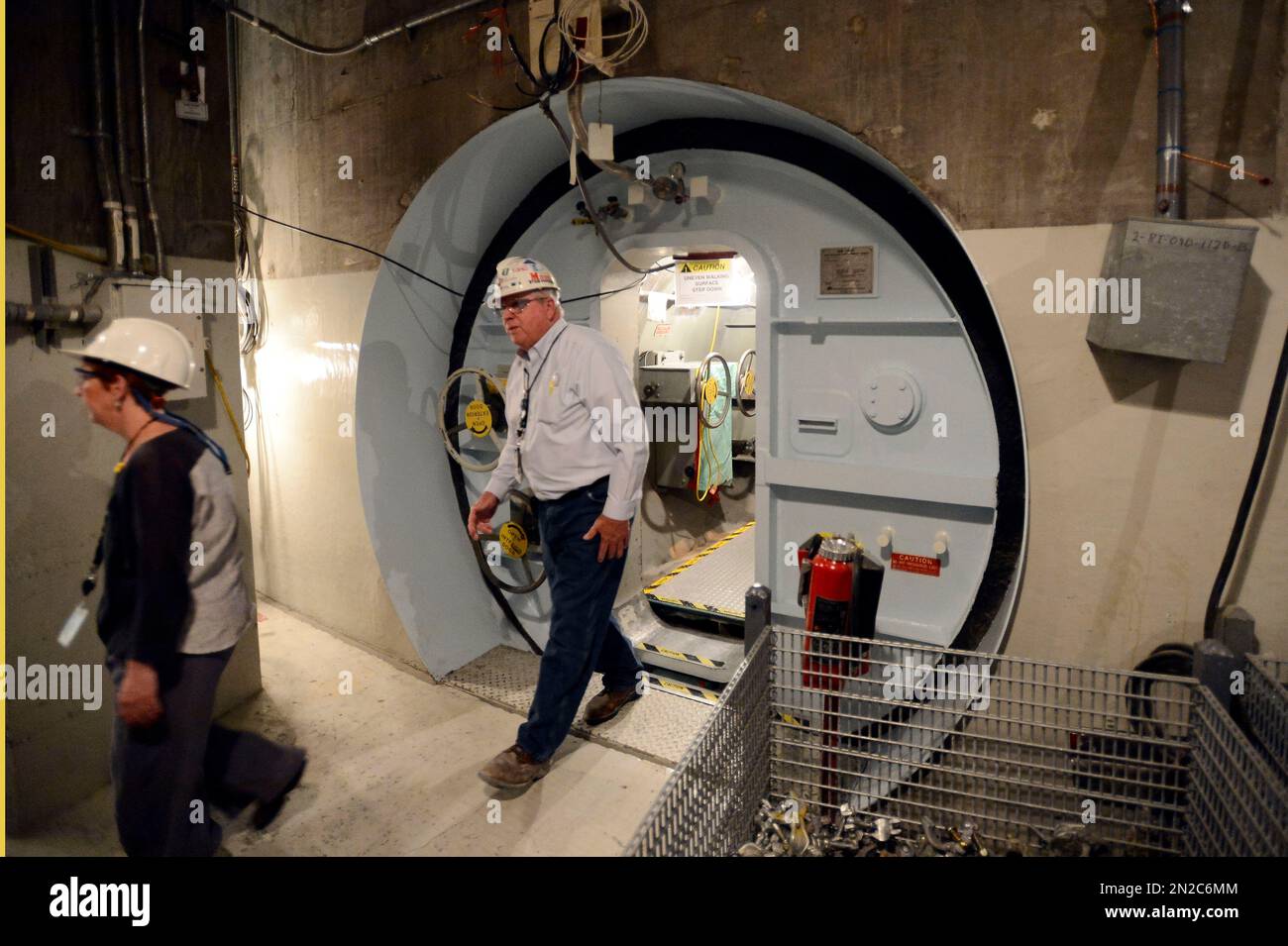 In this April 29, 2015 photo, Mike Totten, right, leaves the Unit 2 ...