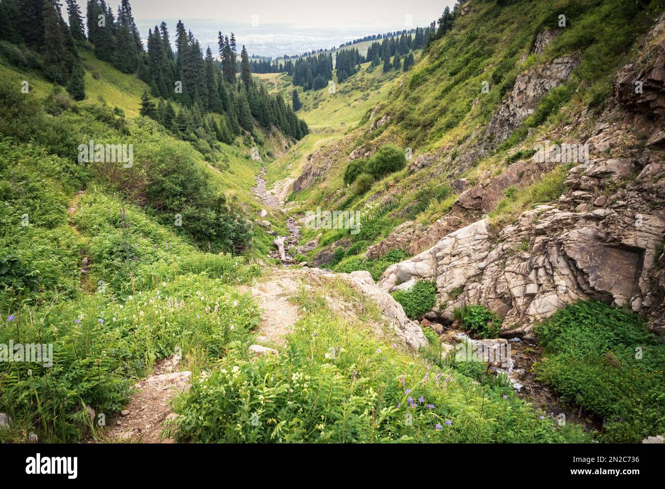 Famous tourist hiking route in the mountains of Almaty - Kimasar Gorge, View towards the city of ...
