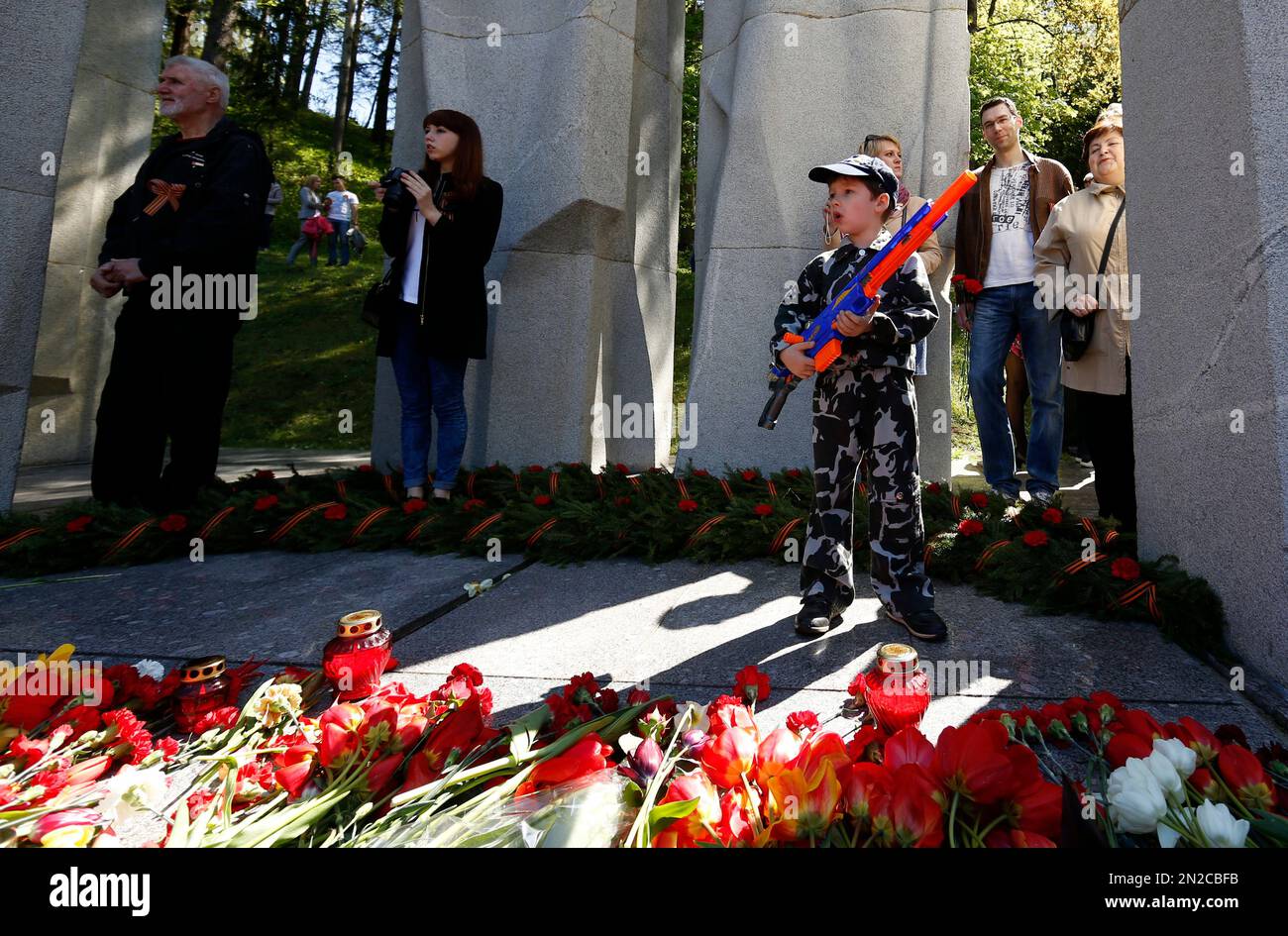 A child stands near the grave of the Unknown Soldier, during a memorial ...