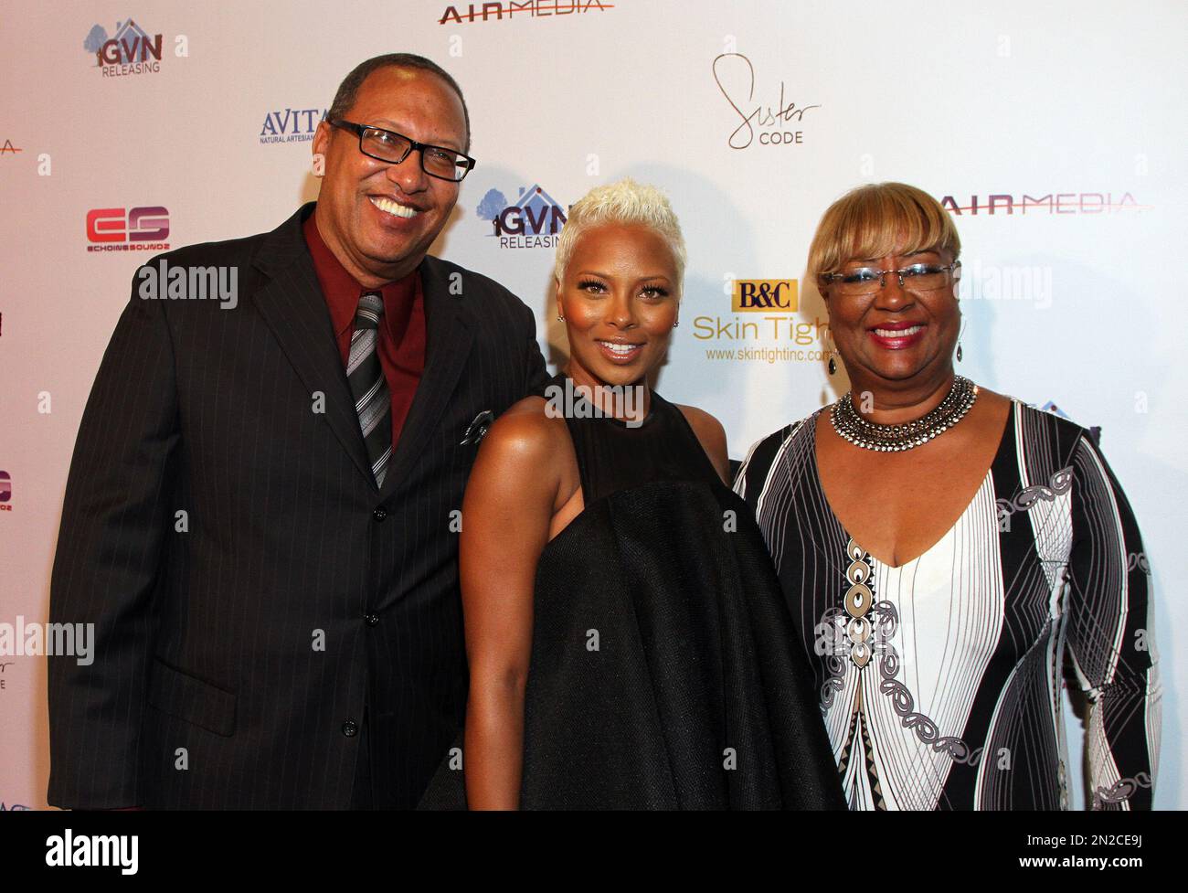 Actress Eva Marcille (C) with parents Evan Pigford and Michelle Pigford ...