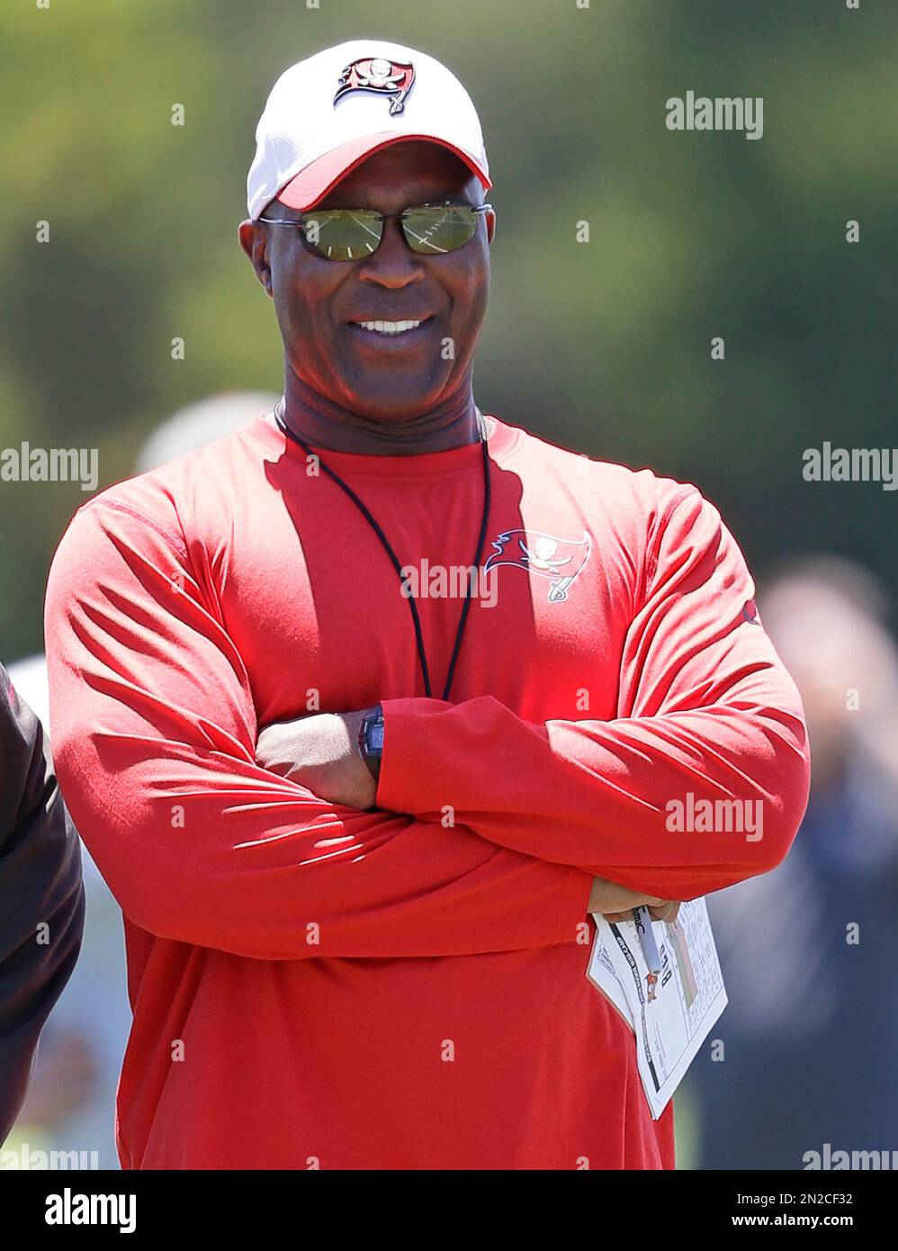 Tampa Bay Buccaneers head coach Lovie Smith smiles as he watches ...