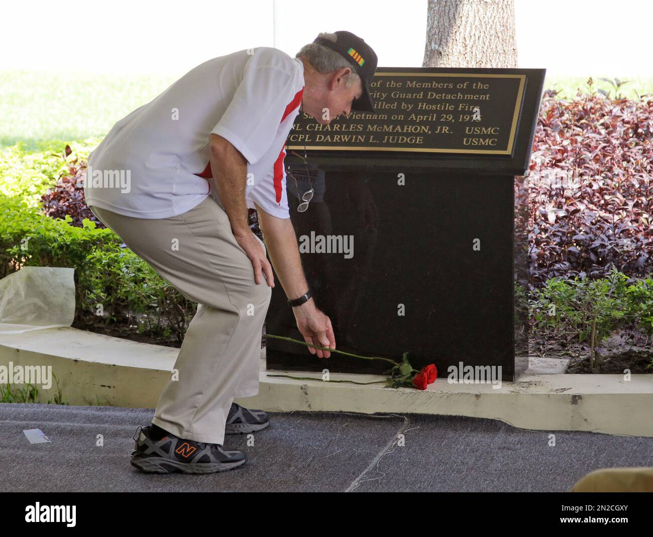 Former U.S. Marine Sgt. Kevin Maloney of Hollywood, Florida, places a ...