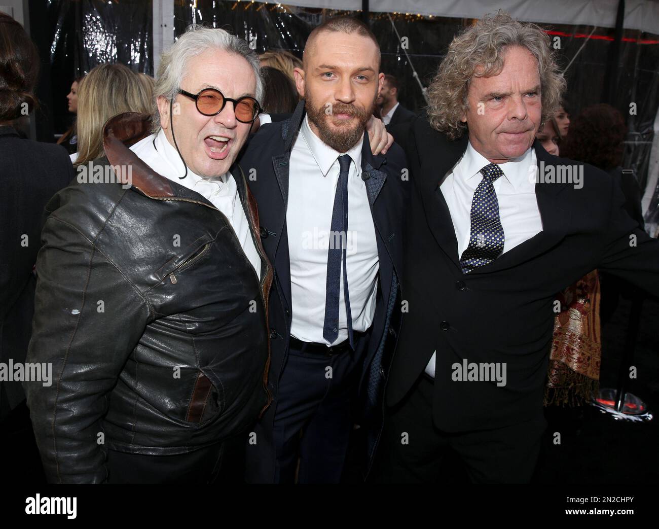 Director/producer George Miller, from left, Tom Hardy and Doug Mitchell ...
